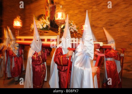 Penitents wearing penitential robes (nazareno), Holy Week procession ...