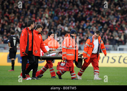 Injured football player on a stretcher Stock Photo - Alamy