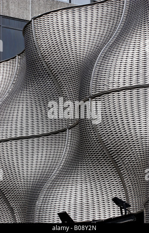 Patterns made by the steel weave of an architectural facade Stock Photo ...