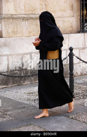 Penitent dressed in black robe (nazareno) on their way to the Holy Week ...