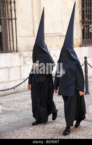 Penitent dressed in black penitential robe (nazareno) on their way to ...