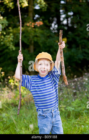 A young boy collecting sticks in Western Kenya Stock Photo - Alamy