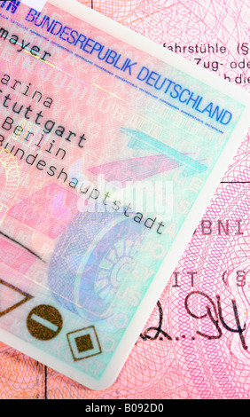 an old and new German driving license with the inscription ...