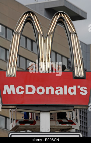 Mc Donalds neon sign gets repaired Stock Photo - Alamy
