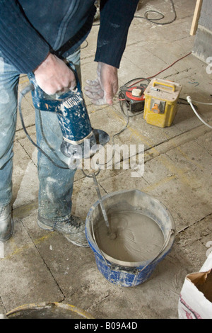Mixing building tools in Bucket Stock Photo - Alamy