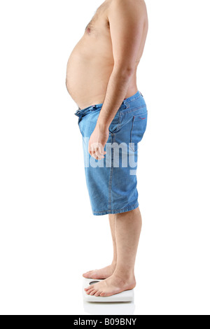 fat man use scale to measure his waistline Stock Photo - Alamy