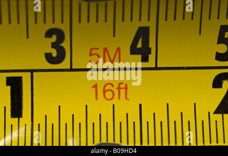 Stock photo of a tape measure showing both the metric and imperial ...