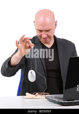 bald headed man holding a computer mouse over mouse trap Stock Photo ...