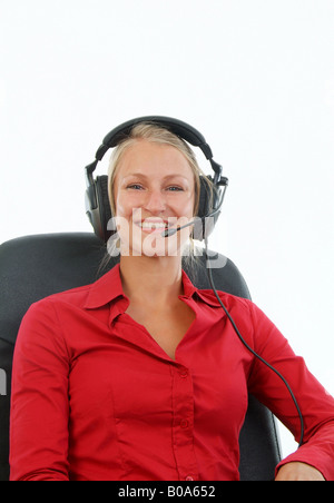 Young beautiful woman wearing shirt standing over red isolated ...