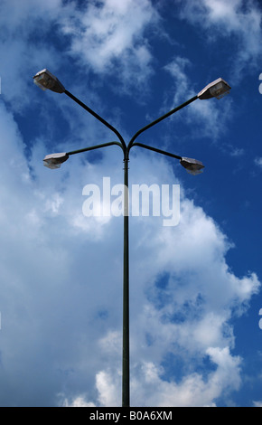 Street light post with four lamps and blue sky background Stock Photo ...