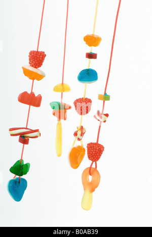 Strings of colorful candy Stock Photo - Alamy