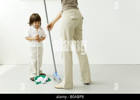 Boy sweeping floor with broom and dustpan Stock Photo: 39613473 - Alamy