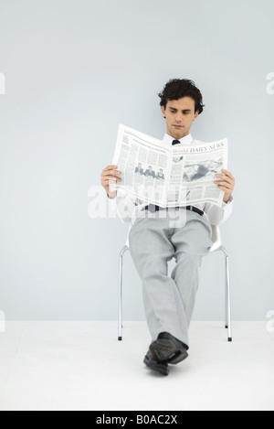 Young businessman slouching in chair, eyes closed Stock Photo - Alamy