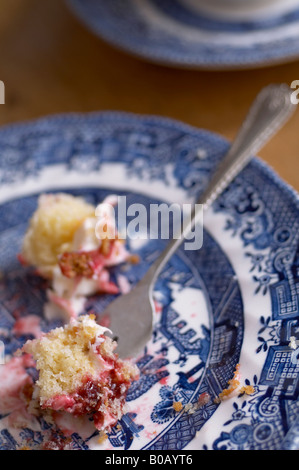 Nearly empty plate after eating cake Stock Photo - Alamy