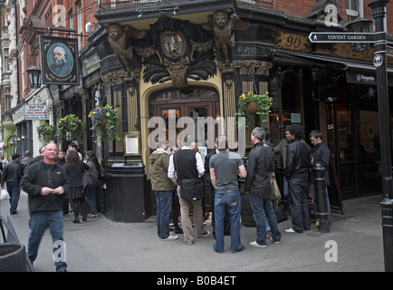 Friday evening after work drinkers outside the Crown & Anchor pub ...