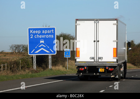 Keep apart 2 chevrons motorway road markings on M56, Cheshire,UK Stock ...