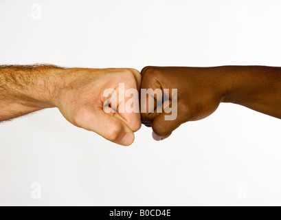 Two fists colliding Stock Photo - Alamy