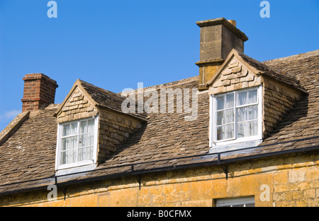 Dormer window on a stone cottage in the Cotswold village of Stanton ...