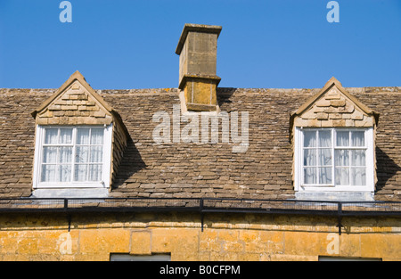 Dormer window on a stone cottage in the Cotswold village of Stanton ...