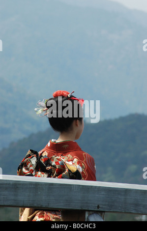 Japan - Geisha Girl walking in garden - bizarre expression Stock Photo ...