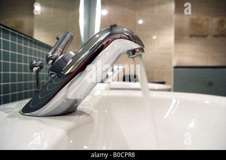 running tap water in bathroom Stock Photo - Alamy