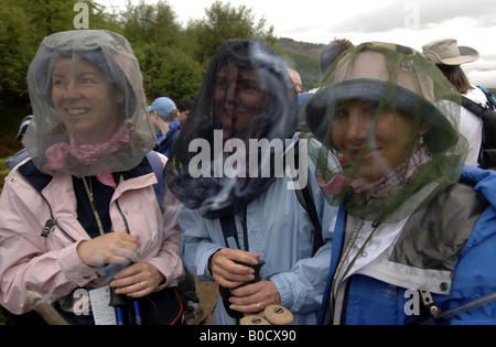 3 women wearing midge nets to protect them from midges Scotland Stock ...