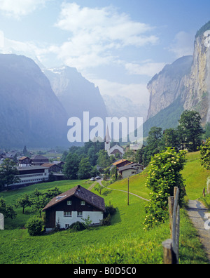 Lauterbrunnen village church and Staubbach Falls cascading down the ...