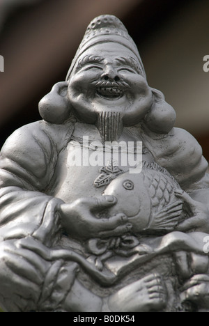 Ebisu, god of fishers or merchants carrying a sea bream. One of the ...