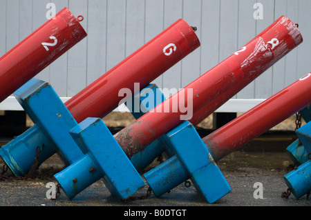 nun buoys lined up on the ground before being put in a channel Stock ...