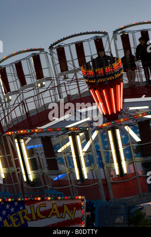Spinning Round-Up Amusement Ride at Night Stock Photo - Alamy