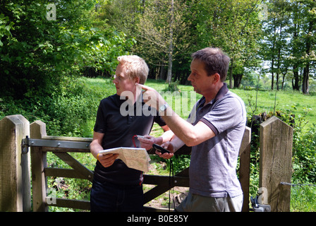 Two men walking and plotting route with GPS Stock Photo - Alamy