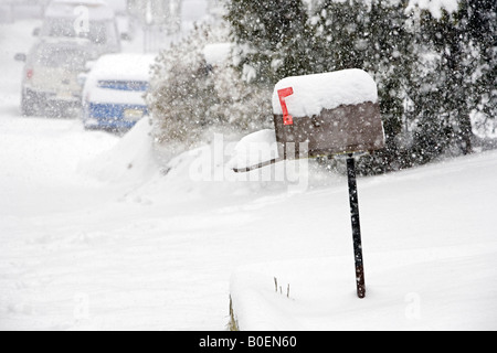 A mailbox covered with snow during winter Stock Photo - Alamy