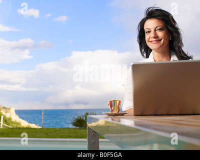 People sitting on the outdoor decking area of the Fistral Boardmasters ...
