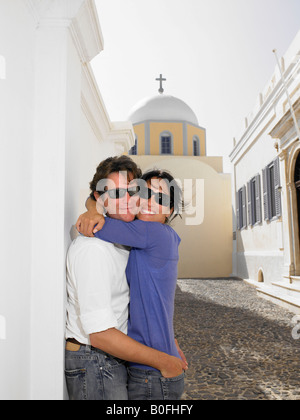 Couple standing on street and hugging. Man hugs a woman view from the ...