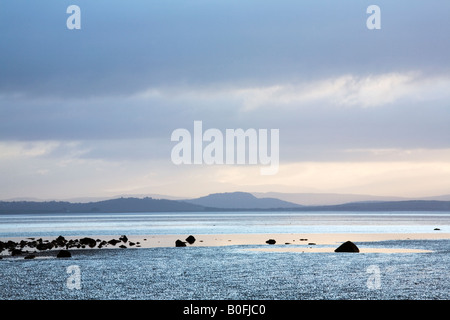 The muted colours of Morecambe Bay soon after a cloudy dawn from the ...