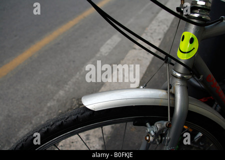 smiley face sticker on bike frame Stock Photo - Alamy