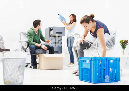 People setting up new office Stock Photo - Alamy