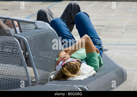 boy laying down on a bench Stock Photo: 43816776 - Alamy