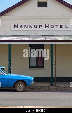 An old blue Holden Ute parked outside a traditional country town pub ...