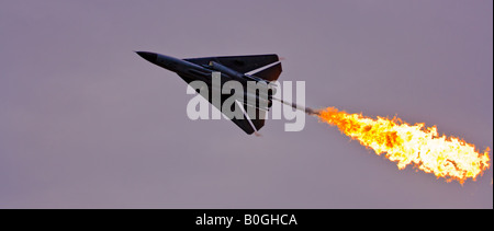 Military jet aircraft F111 with afterburner flame Stock Photo - Alamy