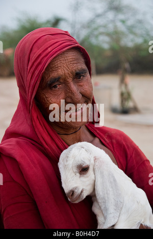 Old Lady With Goat Stock Photo - Alamy