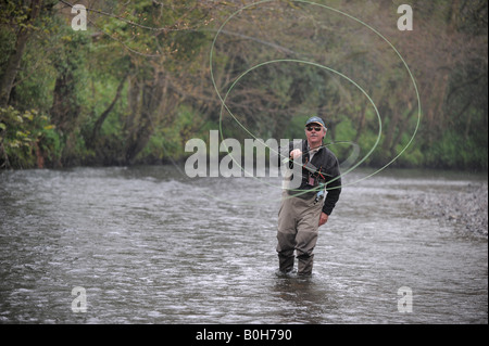 Gary Champion fly fishing and casting his line on the River Lyd, near ...