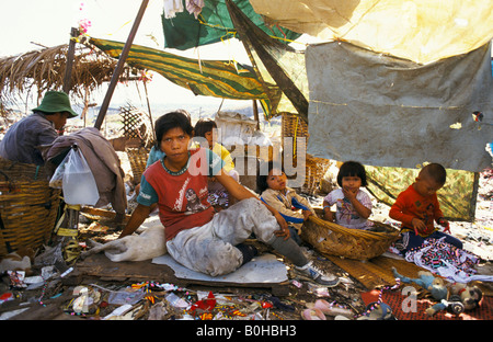 Thailand poverty. Homeless woman scavenging for food. Thailand S. E ...