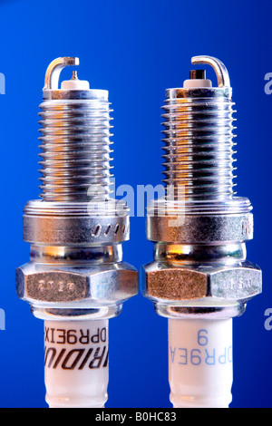 Comparison of iridium spark plug and standard spark plug Stock Photo ...