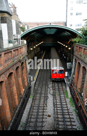 Circle Line train at Notting Hill Gate Underground station in London ...