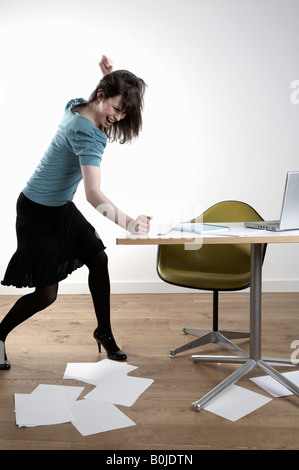 Furious woman hitting desk Stock Photo - Alamy