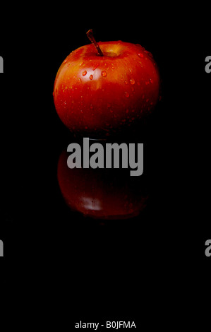 Red Apples isolated against a black background Stock Photo - Alamy