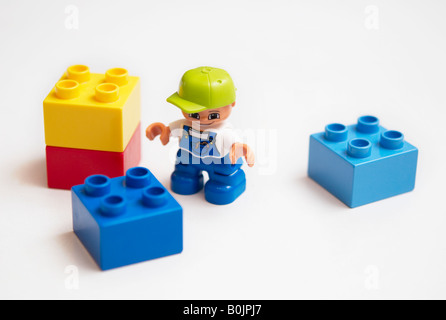 Duplo Lego blocks and Lego man against white background Stock Photo - Alamy
