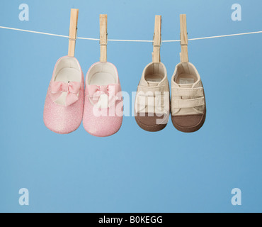 baby clothes on blue background top view Stock Photo - Alamy