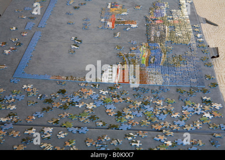 Loose jigsaw puzzle pieces on blue background Stock Photo - Alamy